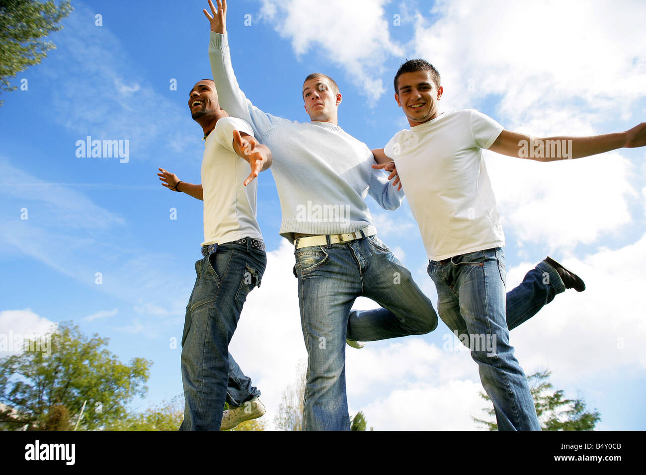 Young men jumping, portrait Stock Photo - Alamy