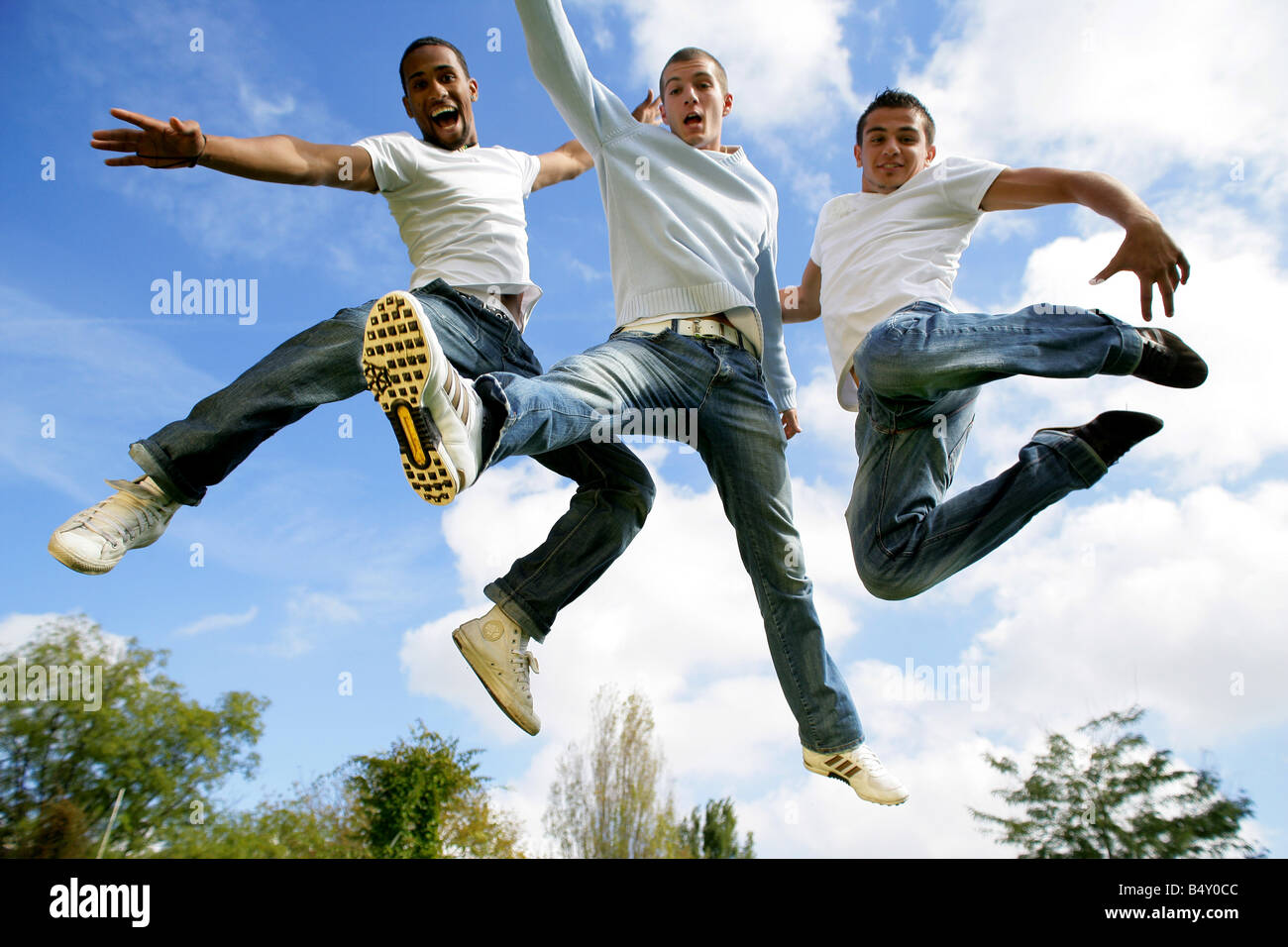 Young men jumping, portrait Stock Photo - Alamy
