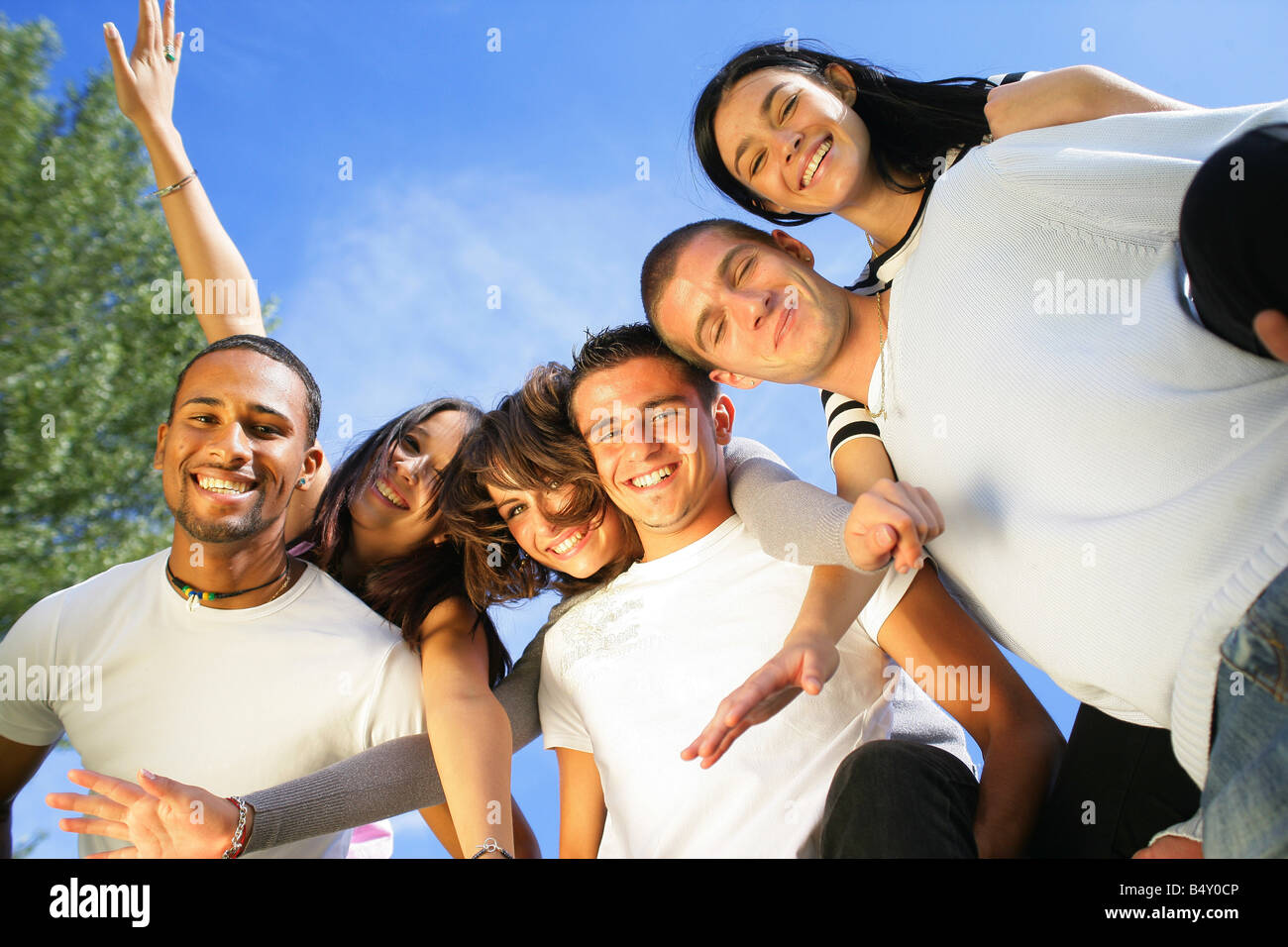 Group of friends stood in park Stock Photo - Alamy