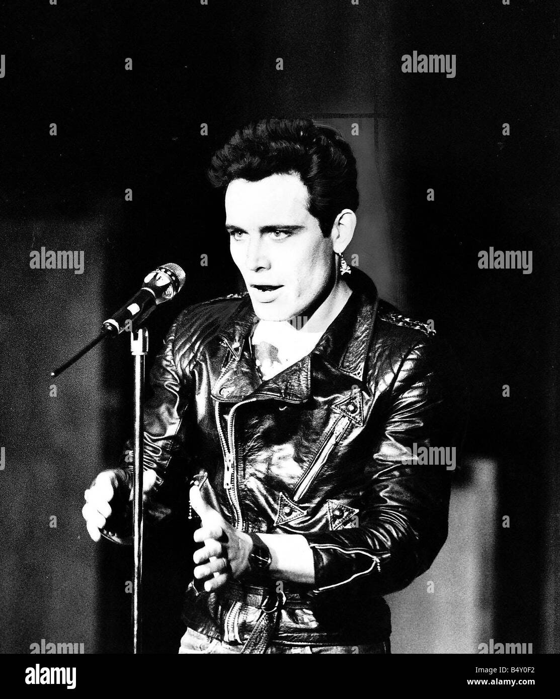 Adam Ant the 1980s British pop singer sings wearing a leather jacket ...