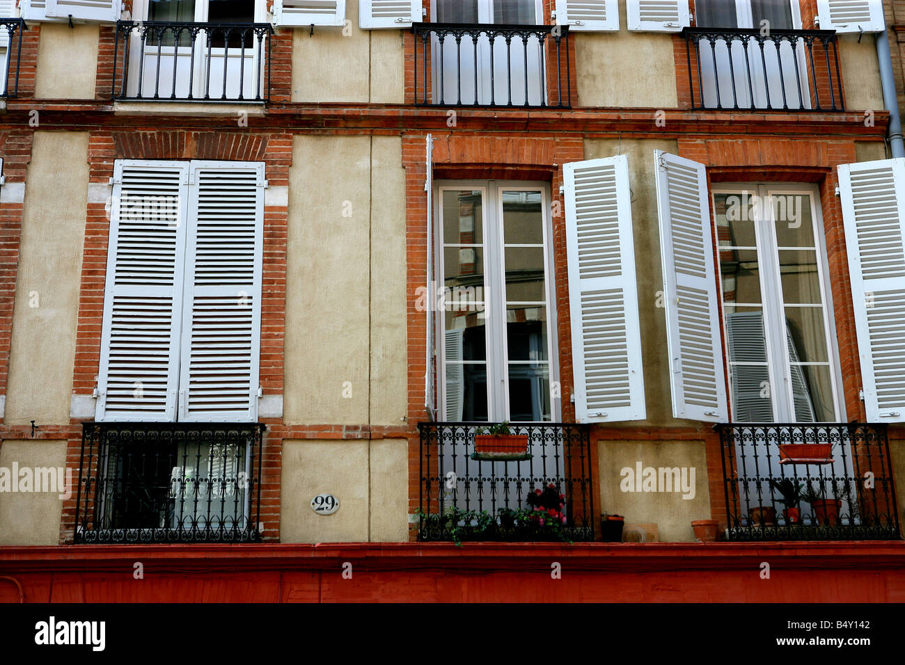 Building with shuttered windows, low angle view Stock Photo - Alamy