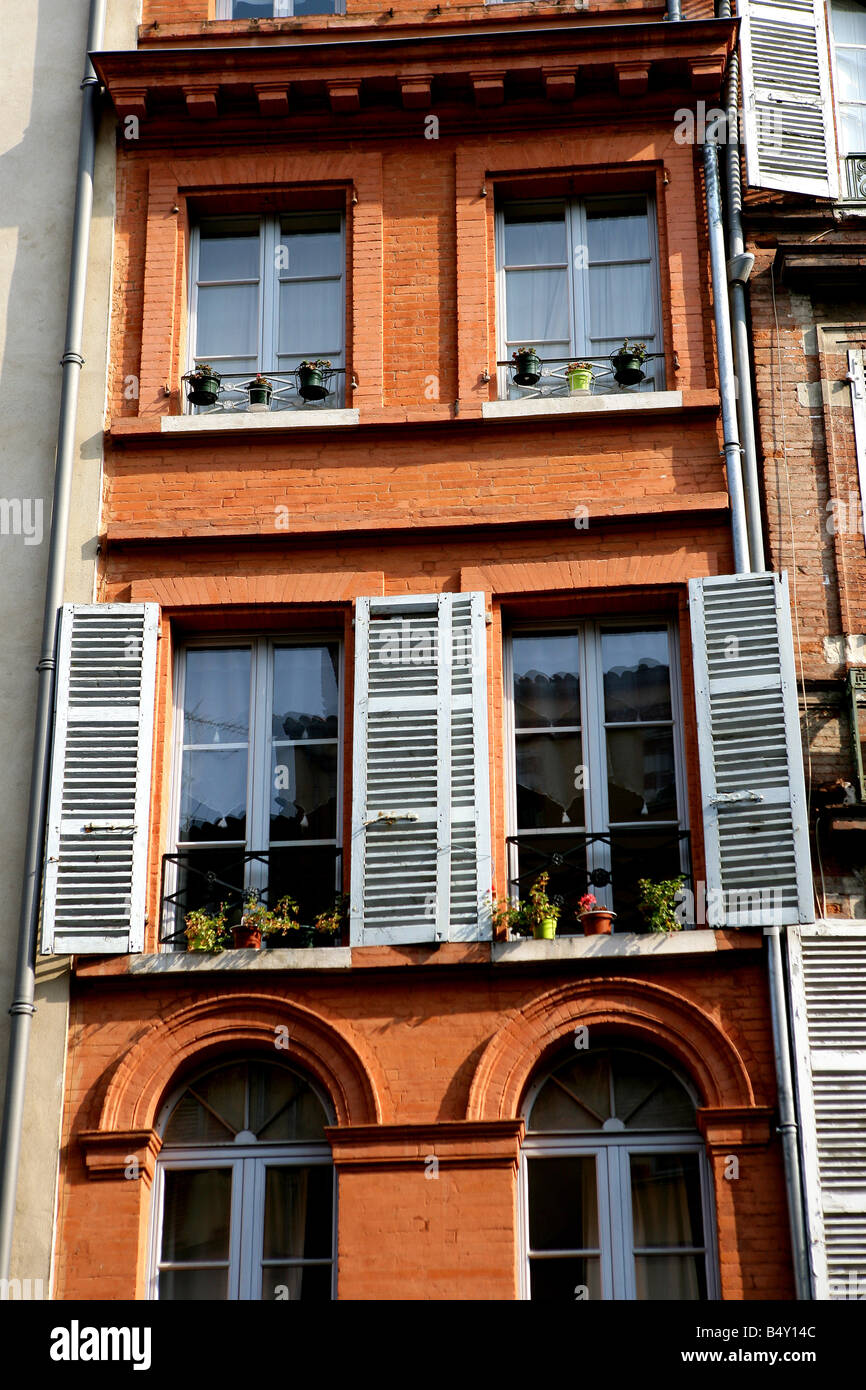 Building with shuttered windows Stock Photo - Alamy