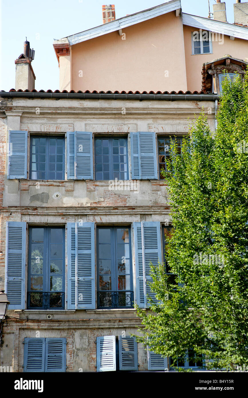 Building with shuttered windows Stock Photo - Alamy