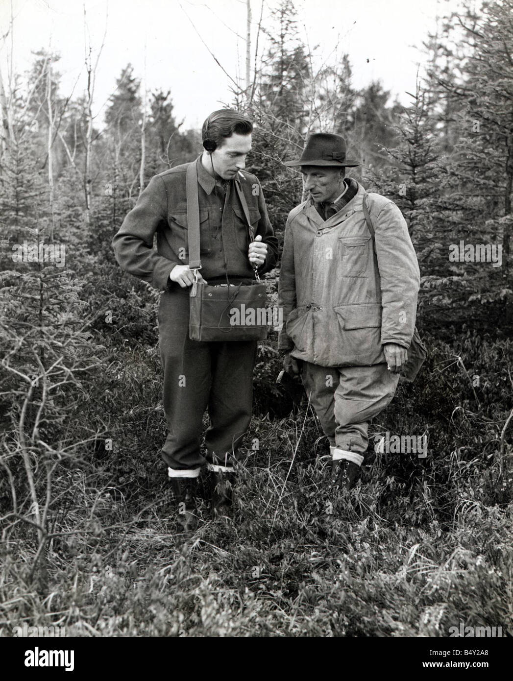 Peter Harris and Michael Harlow October 1947 use a Geiger counter to ...