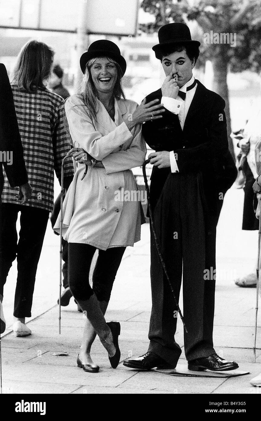 Twiggy Model with man dressed up as Charlie Chaplin Stock Photo - Alamy