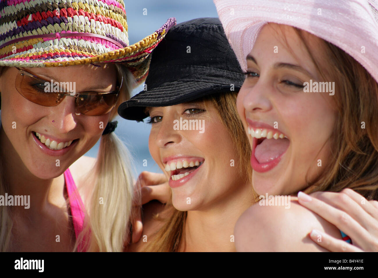 Portrait of 3 young women at the beach Stock Photo - Alamy