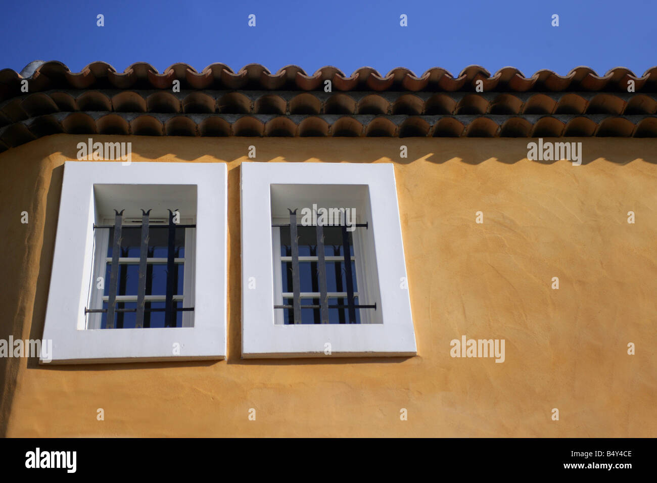 house facade with small windows Stock Photo - Alamy