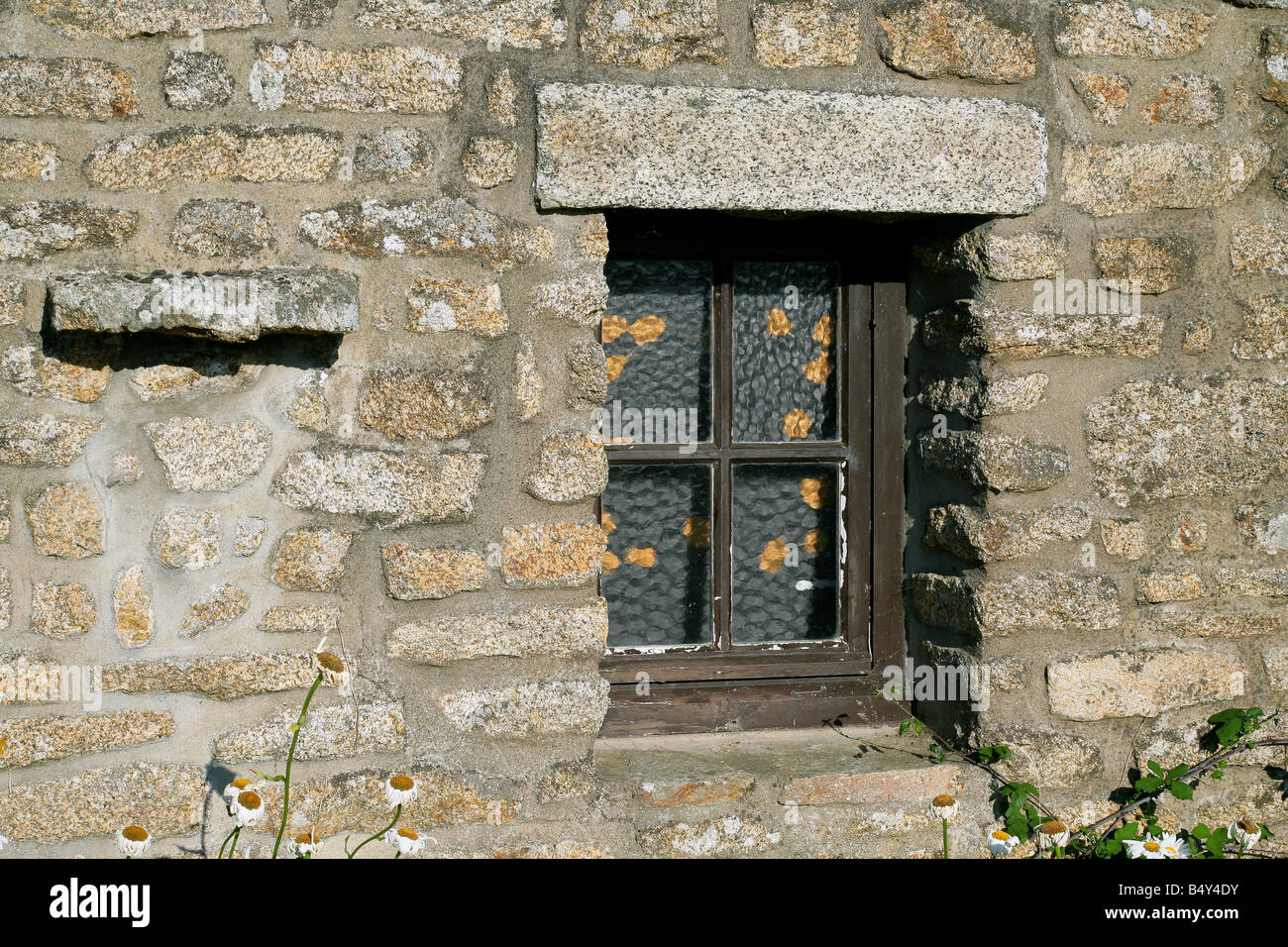 stone house facade with a small window Stock Photo - Alamy
