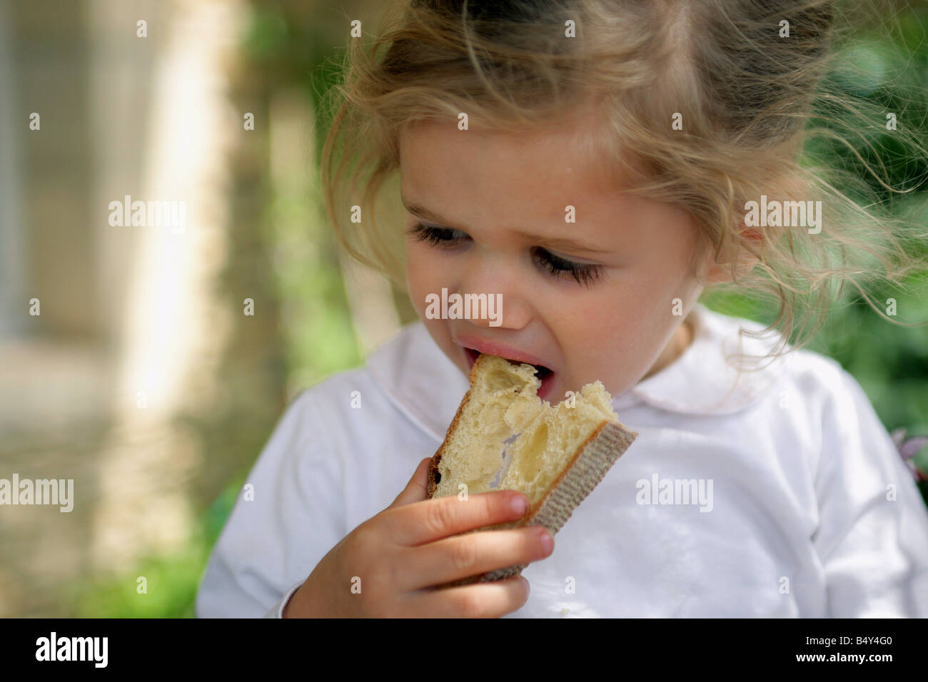 child with a slice of bread Stock Photo - Alamy
