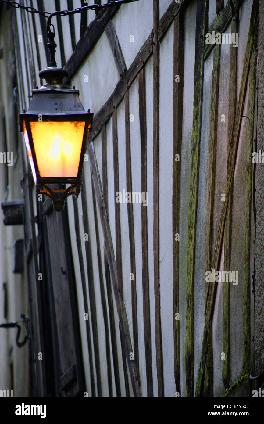 house with half-timbering and street light, lightened lamppost Stock ...