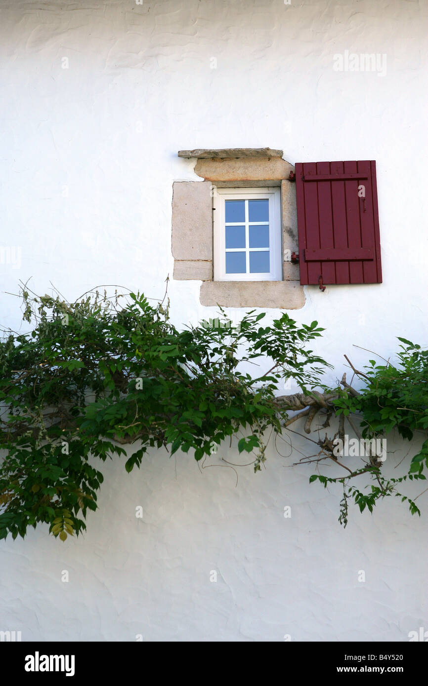 house façade with a small window Stock Photo - Alamy