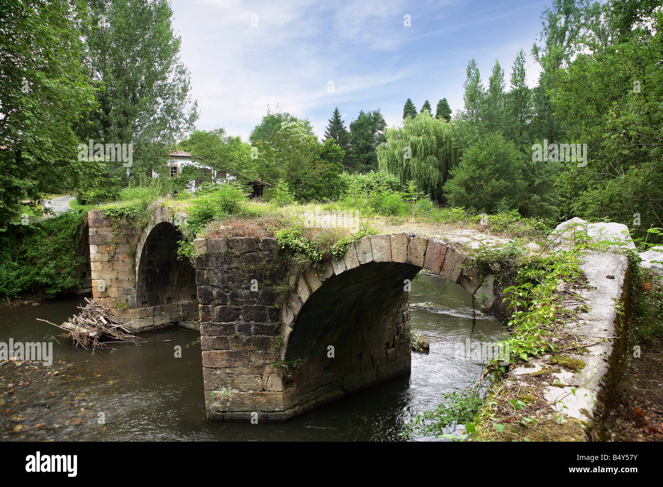 small bridge over a river and cloudy sky Stock Photo - Alamy