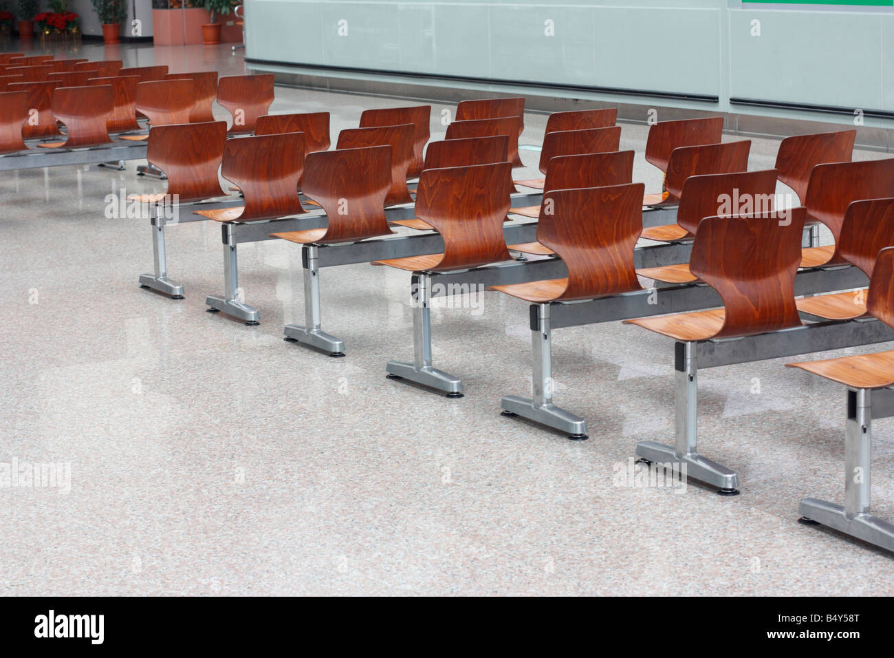 Rows of empty wooden chairs Stock Photo - Alamy