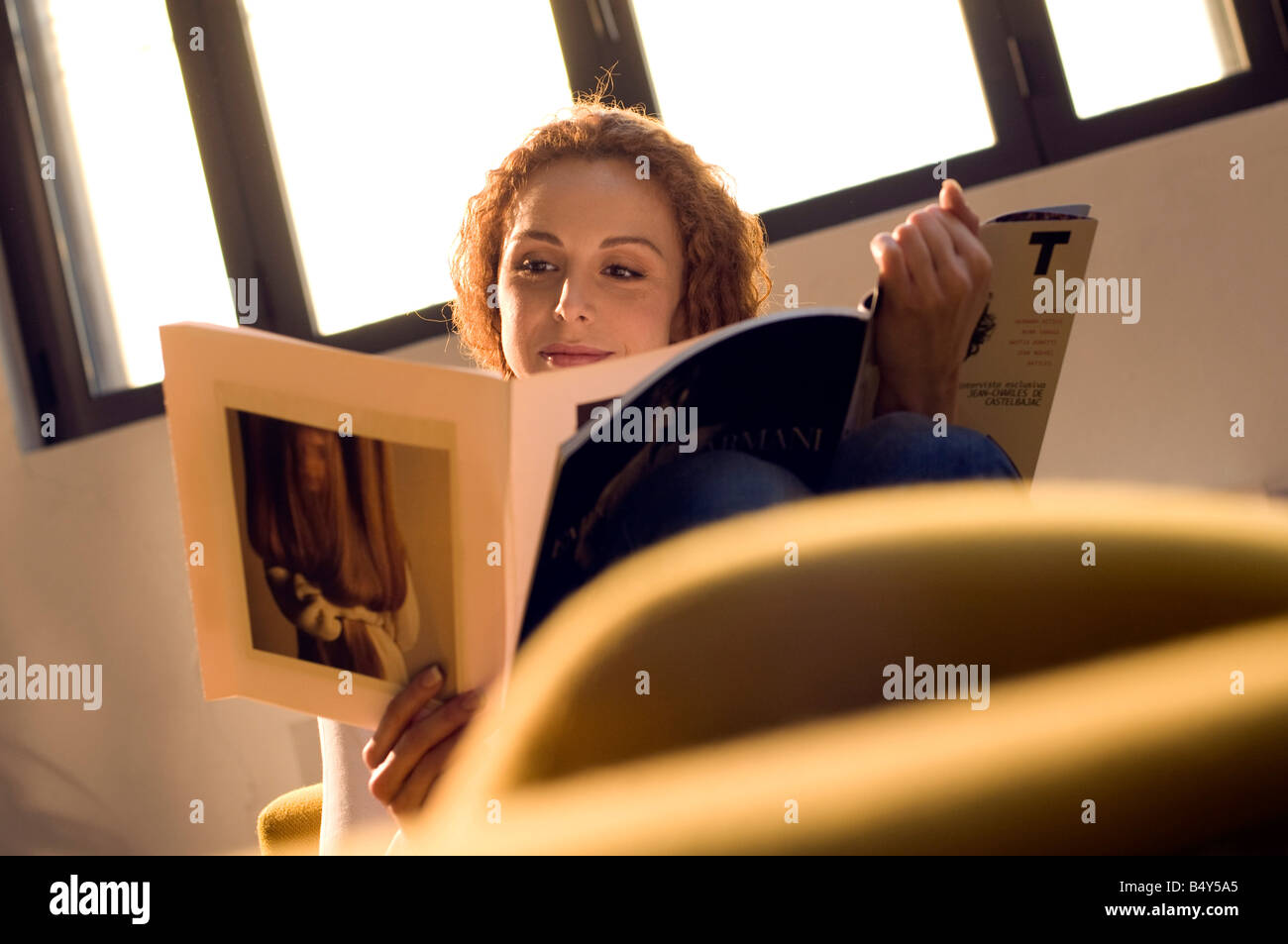 woman reading a magazine Stock Photo - Alamy