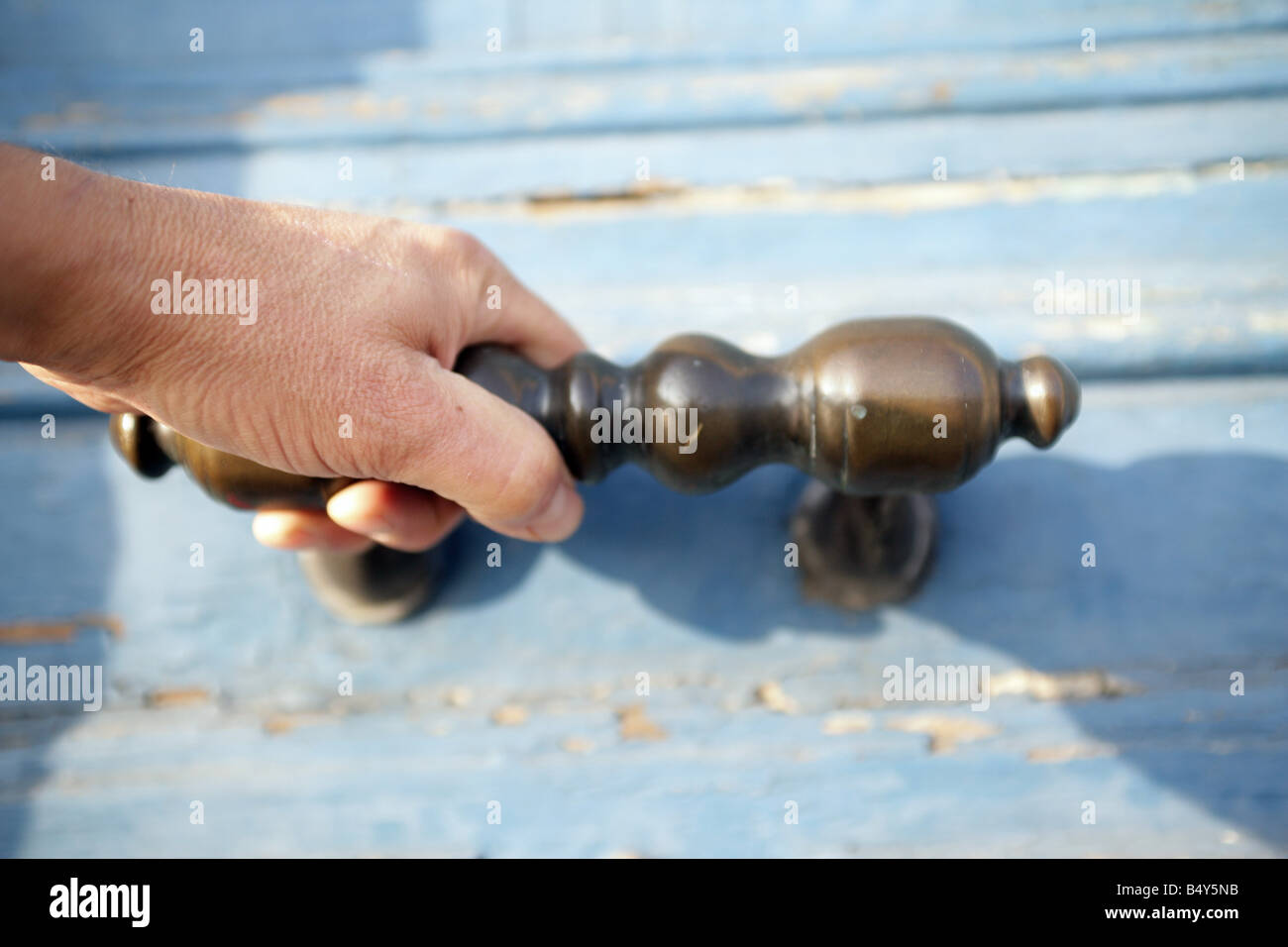 Human hand holding door handle, close-up Stock Photo - Alamy