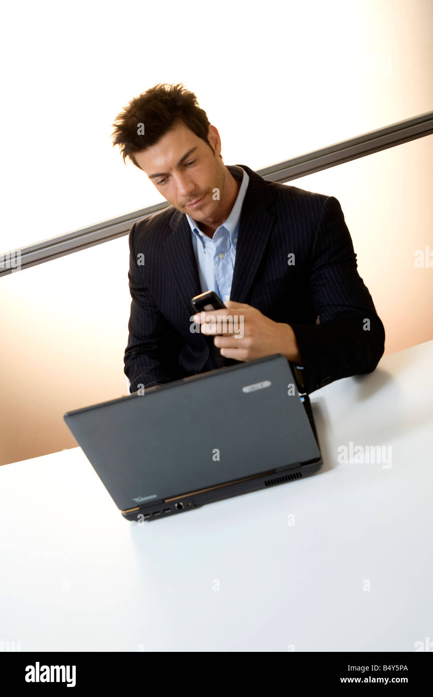man with notebook and mobile phone Stock Photo - Alamy