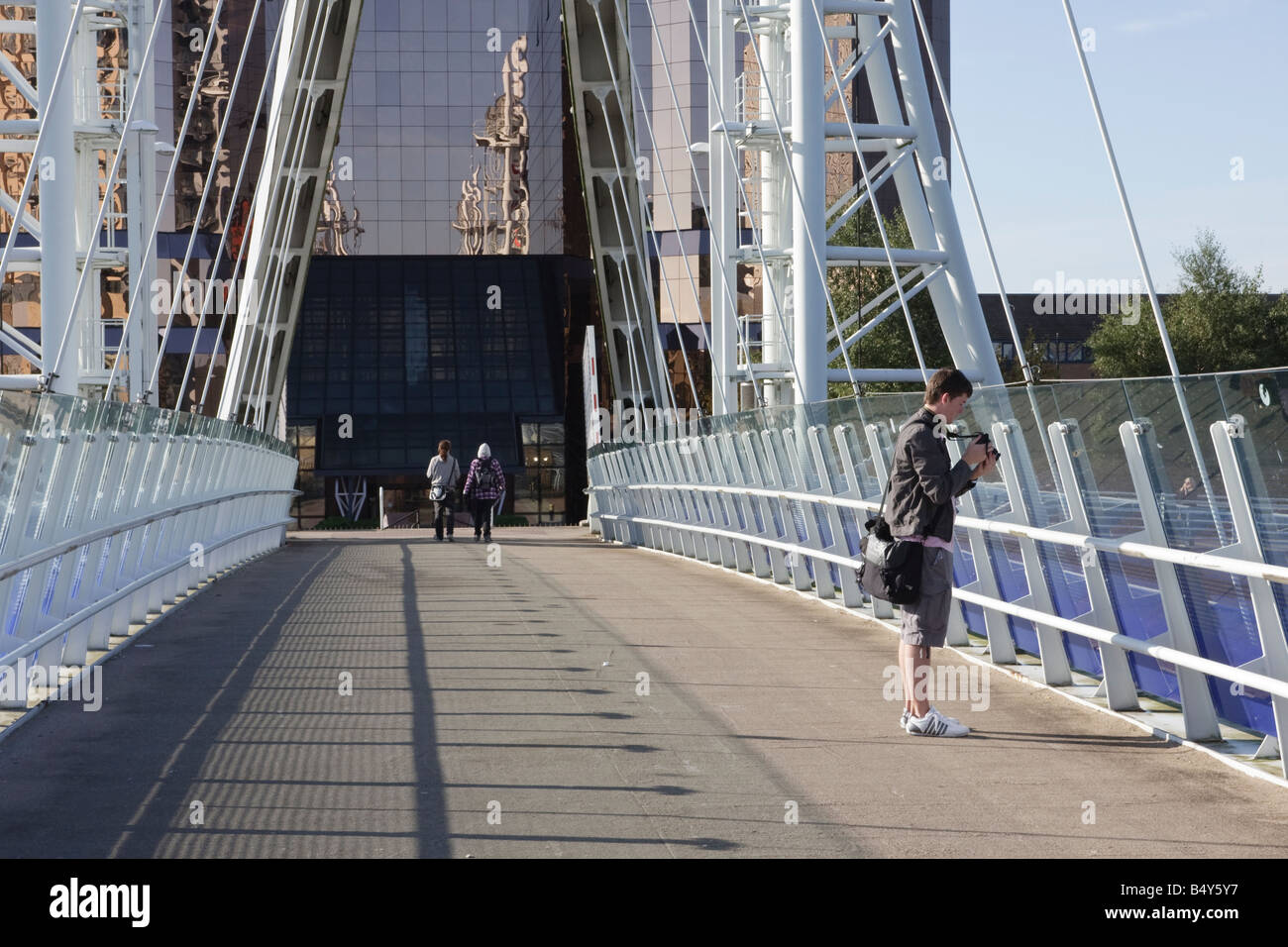 A Young Male College Student Stands on the Millenium Bridge over the ...