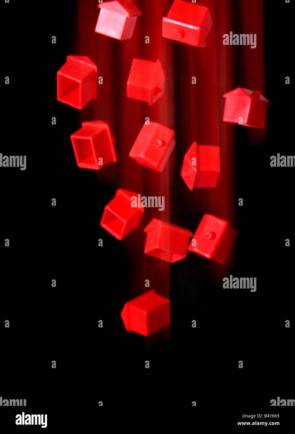 Monopoly houses falling Stock Photo - Alamy