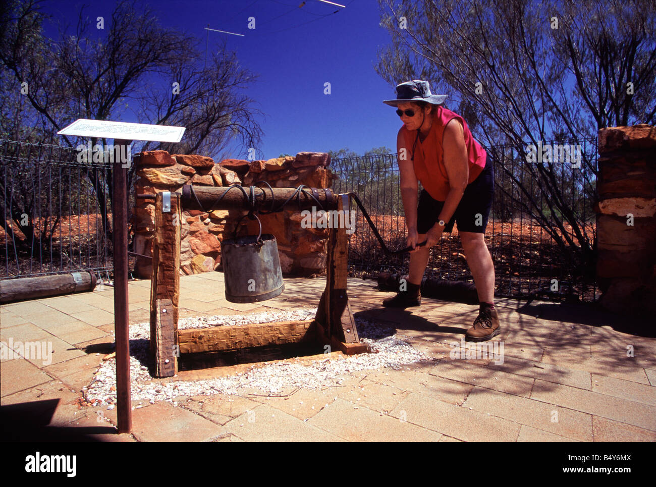 A woman uses an old winch used in central Australia's first ever ...