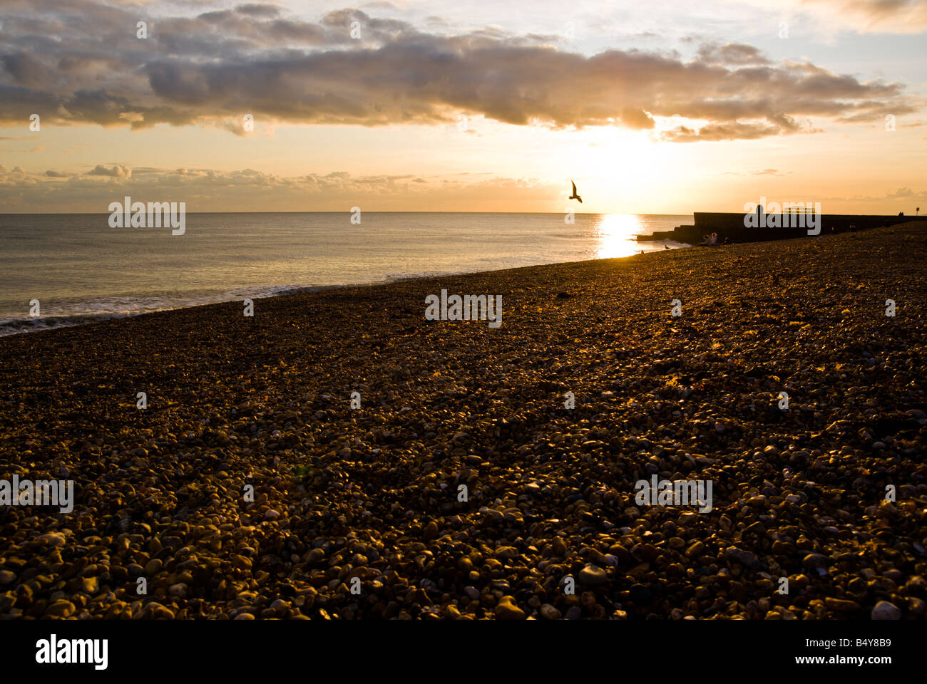 Beach at sunset hi-res stock photography and images - Alamy