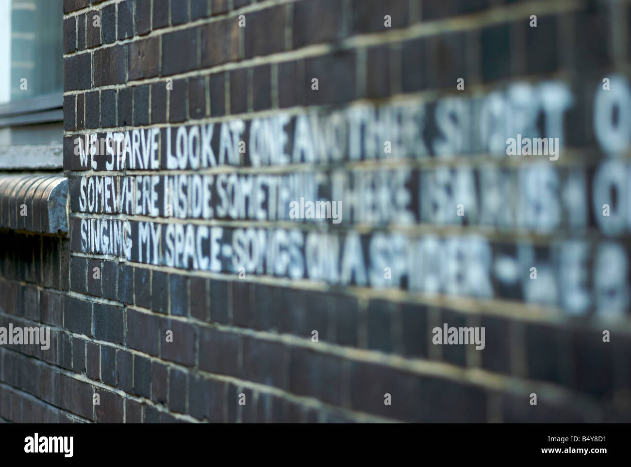 Graffiti poetry on a brick wall in London Stock Photo - Alamy
