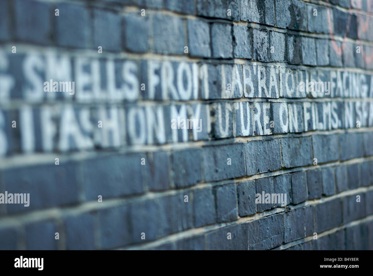 Graffiti poetry on a brick wall in London Stock Photo - Alamy