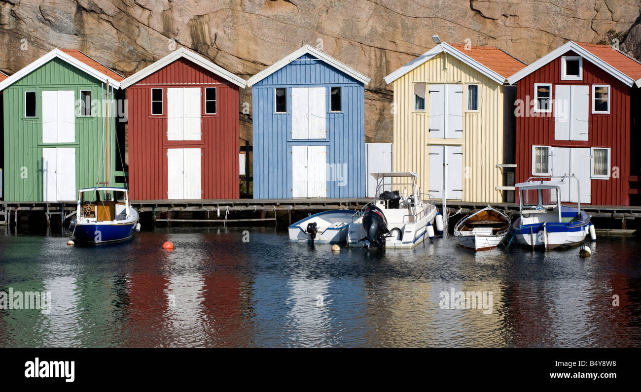 Boats and colourful boathouses at fishing village of Smogen on Bohuslan ...
