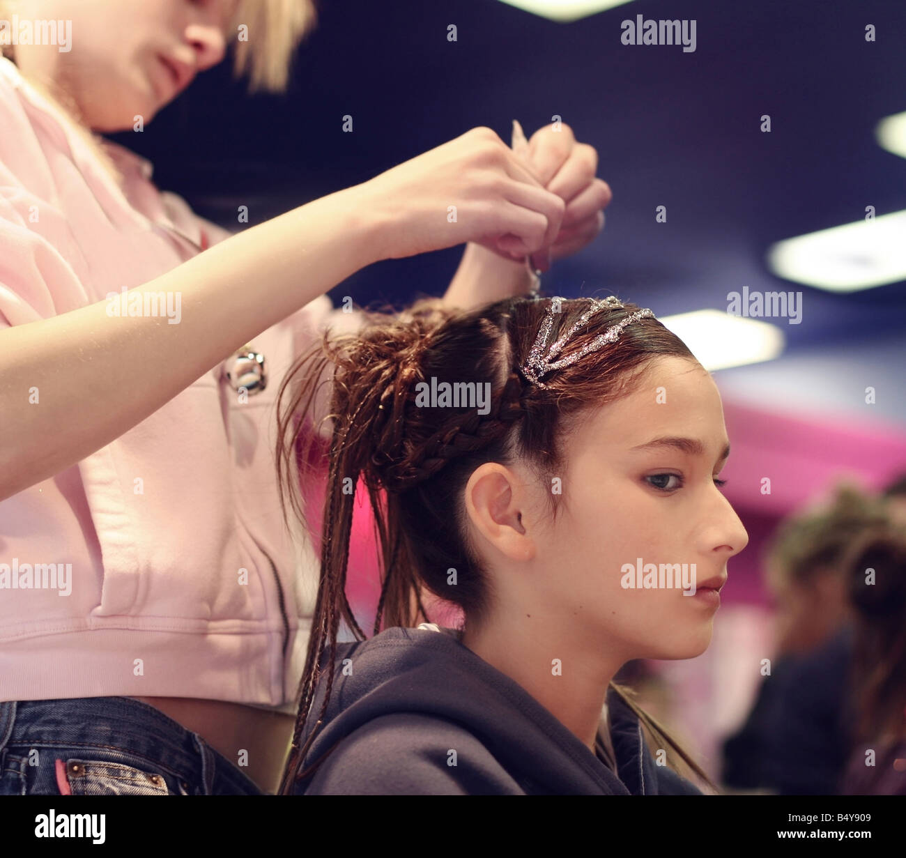 A girl getting her hair done Stock Photo - Alamy