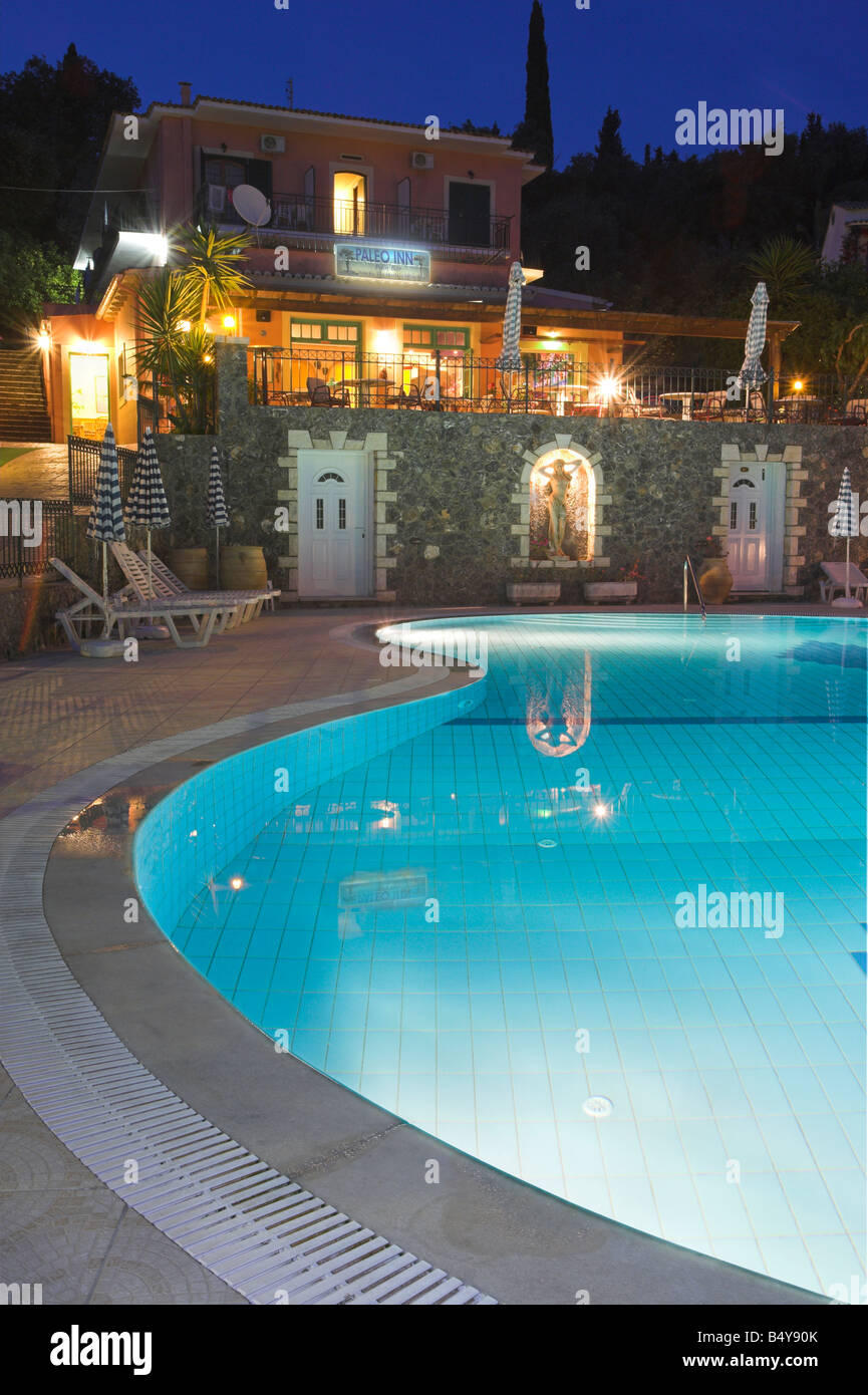 Hotel pool and bar at night Stock Photo - Alamy