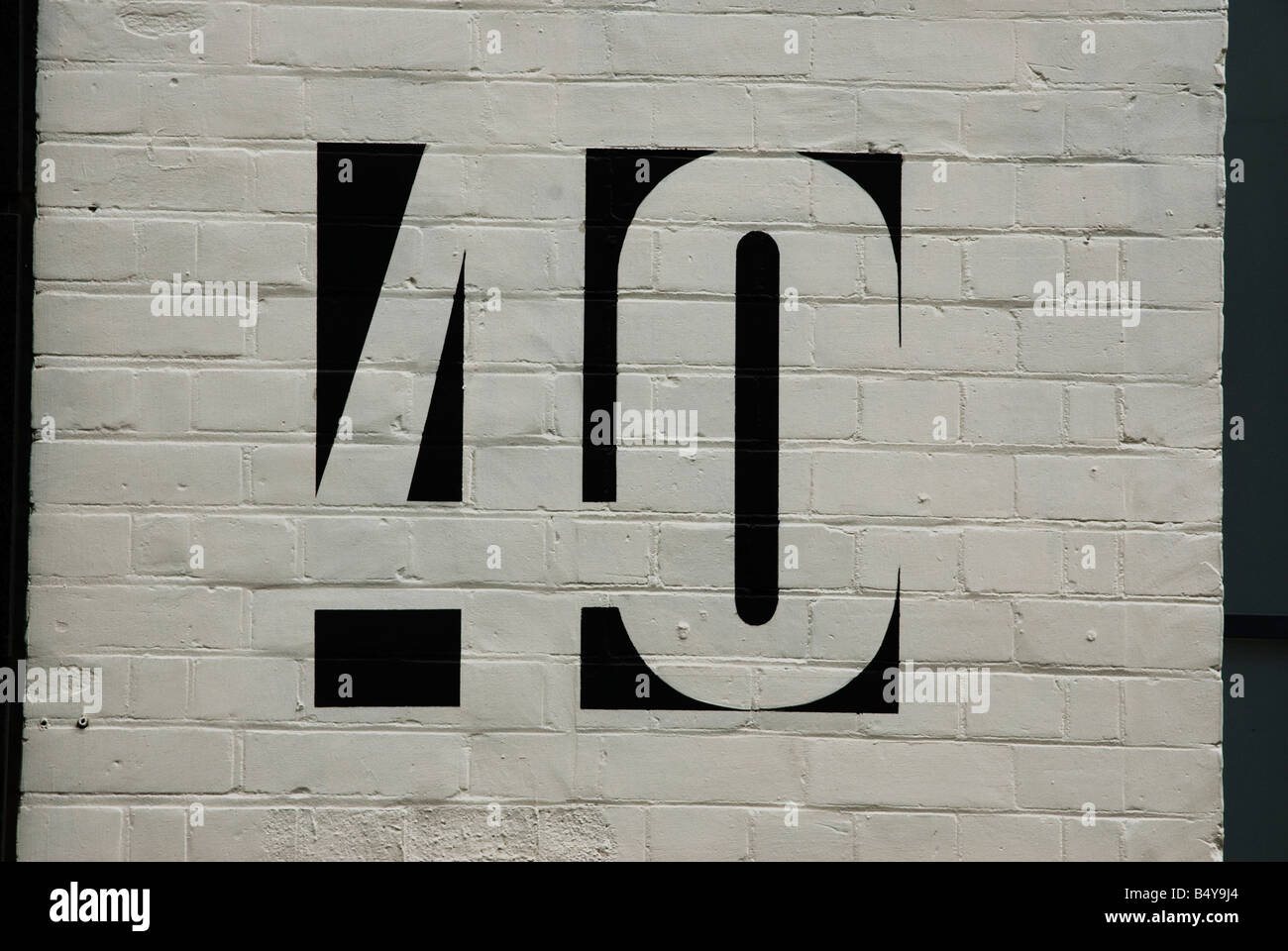 Number 40 painted on a white brick wall Stock Photo - Alamy