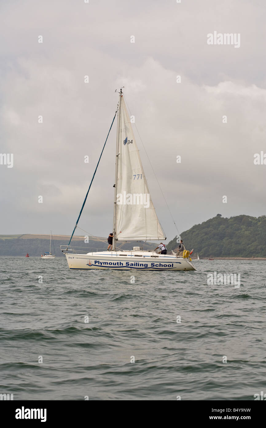 A Sailing School yacht teaching people how to sail Stock Photo - Alamy
