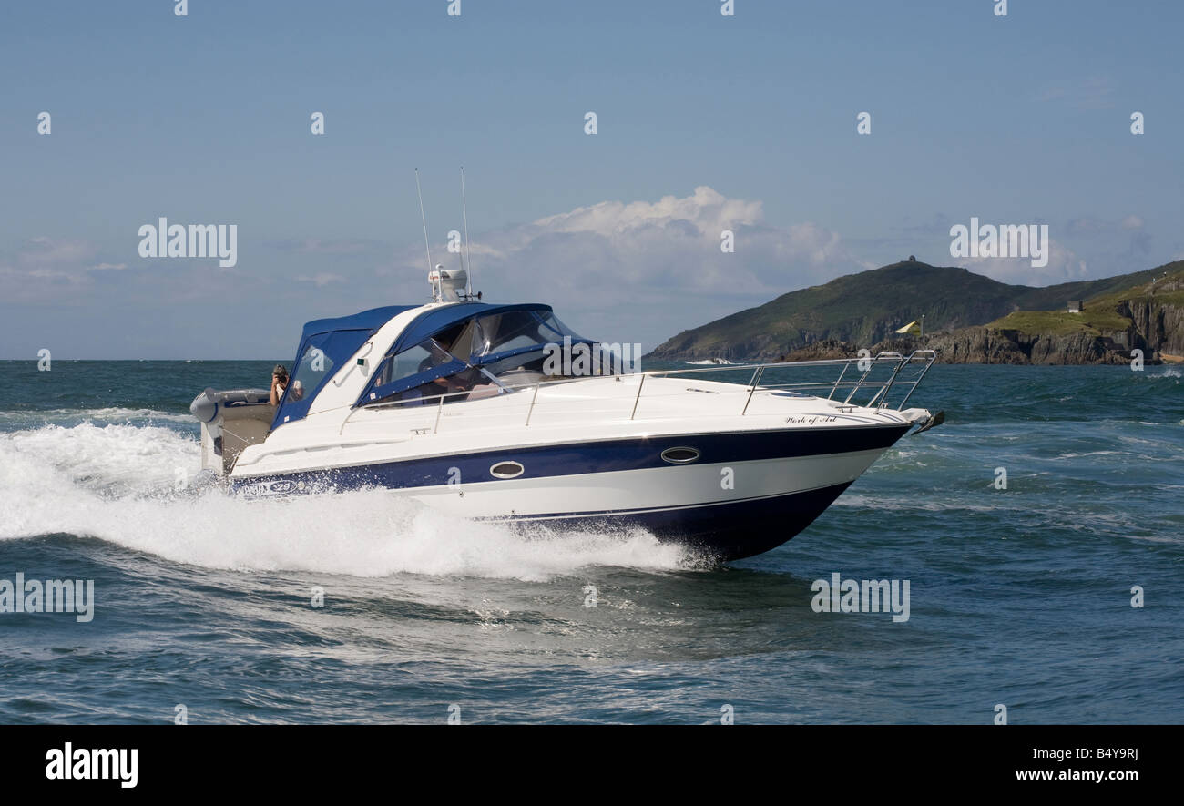 Motor Cruiser at speed riding the groundswell off Penlee Point Cornwall ...