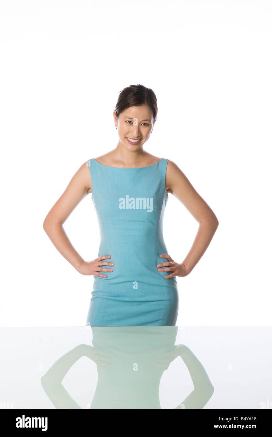 Asian woman with a blue dress isolated against white background Stock ...