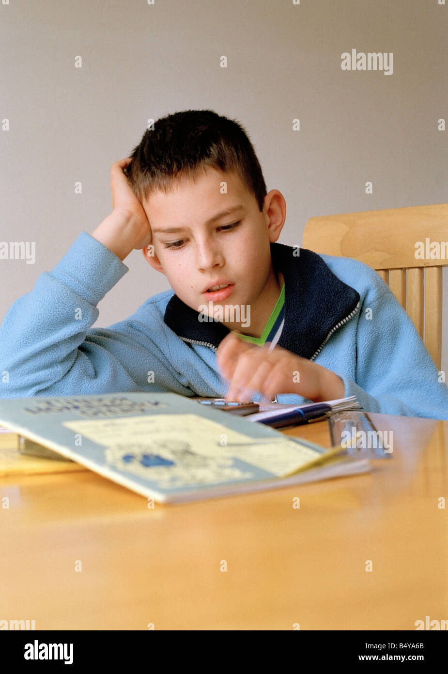 A boy doing his homework Stock Photo - Alamy