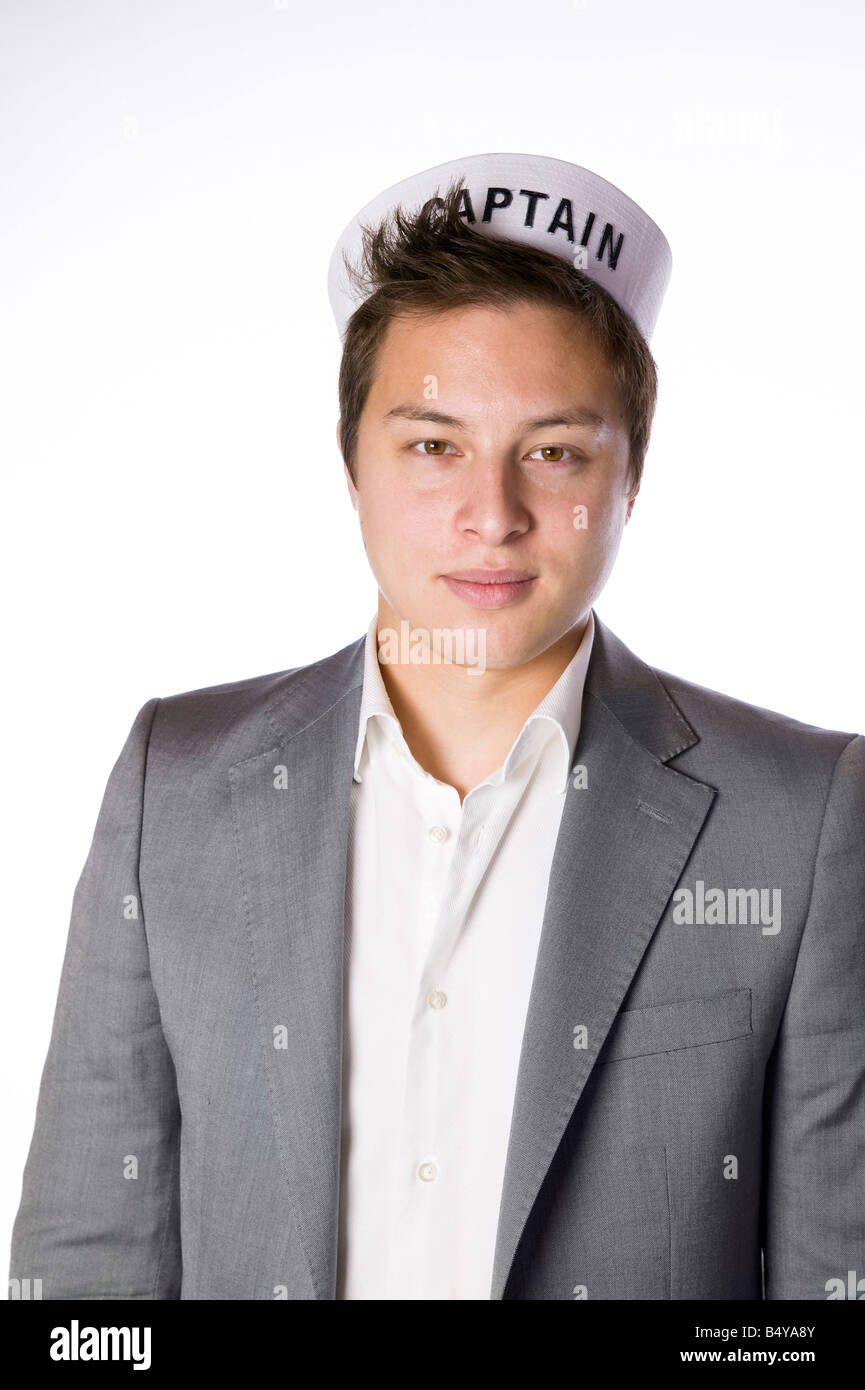 Asian man wearing a captains sailor style hat Stock Photo - Alamy