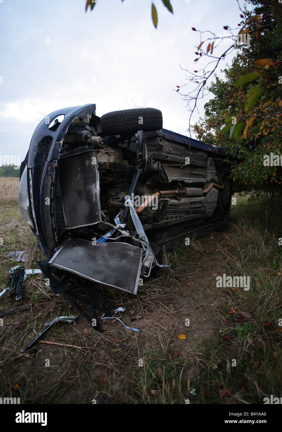 Car on its side after hard crash and roll Stock Photo - Alamy