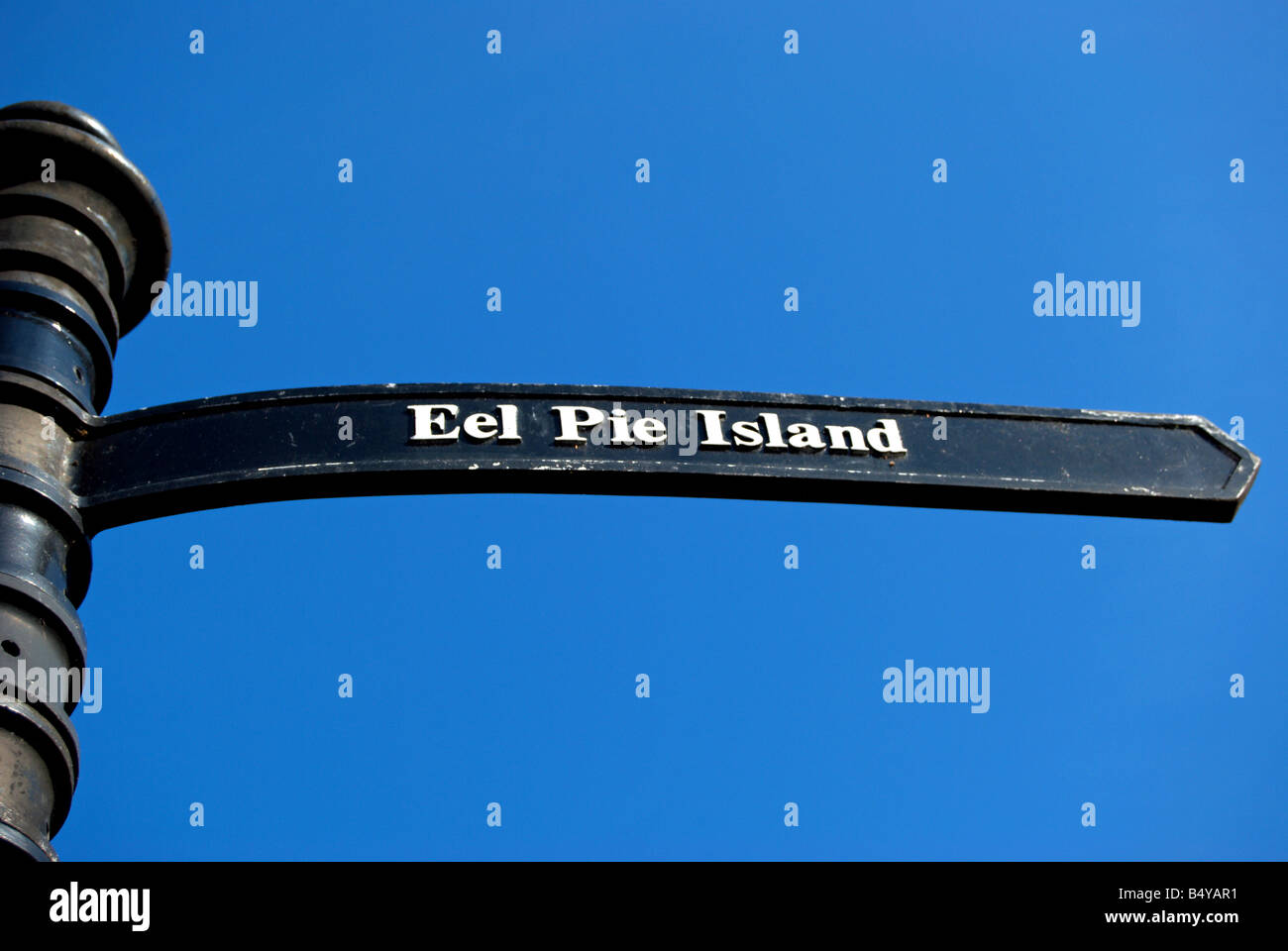 black sign with white lettering indicating the route to eel pie island ...
