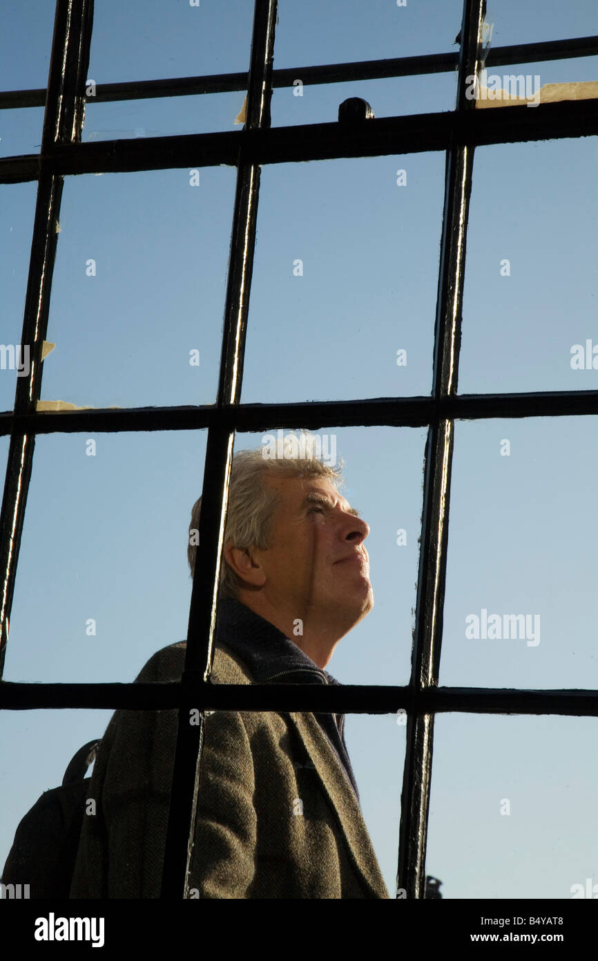 man viewed behind bar Stock Photo - Alamy