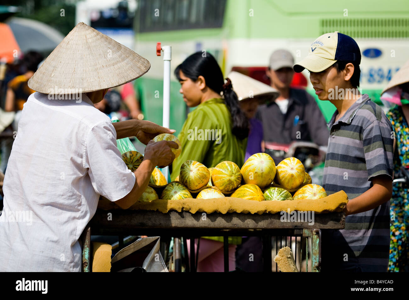 Street vendor selling yellow striped watermelon Stock Photo - Alamy