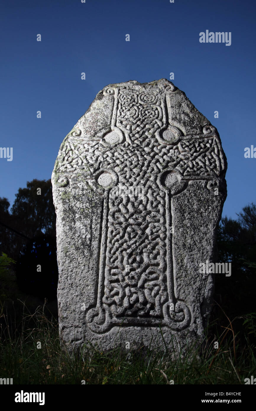 Ancient stone slab with carved Celtic Cross design, on the shores of ...