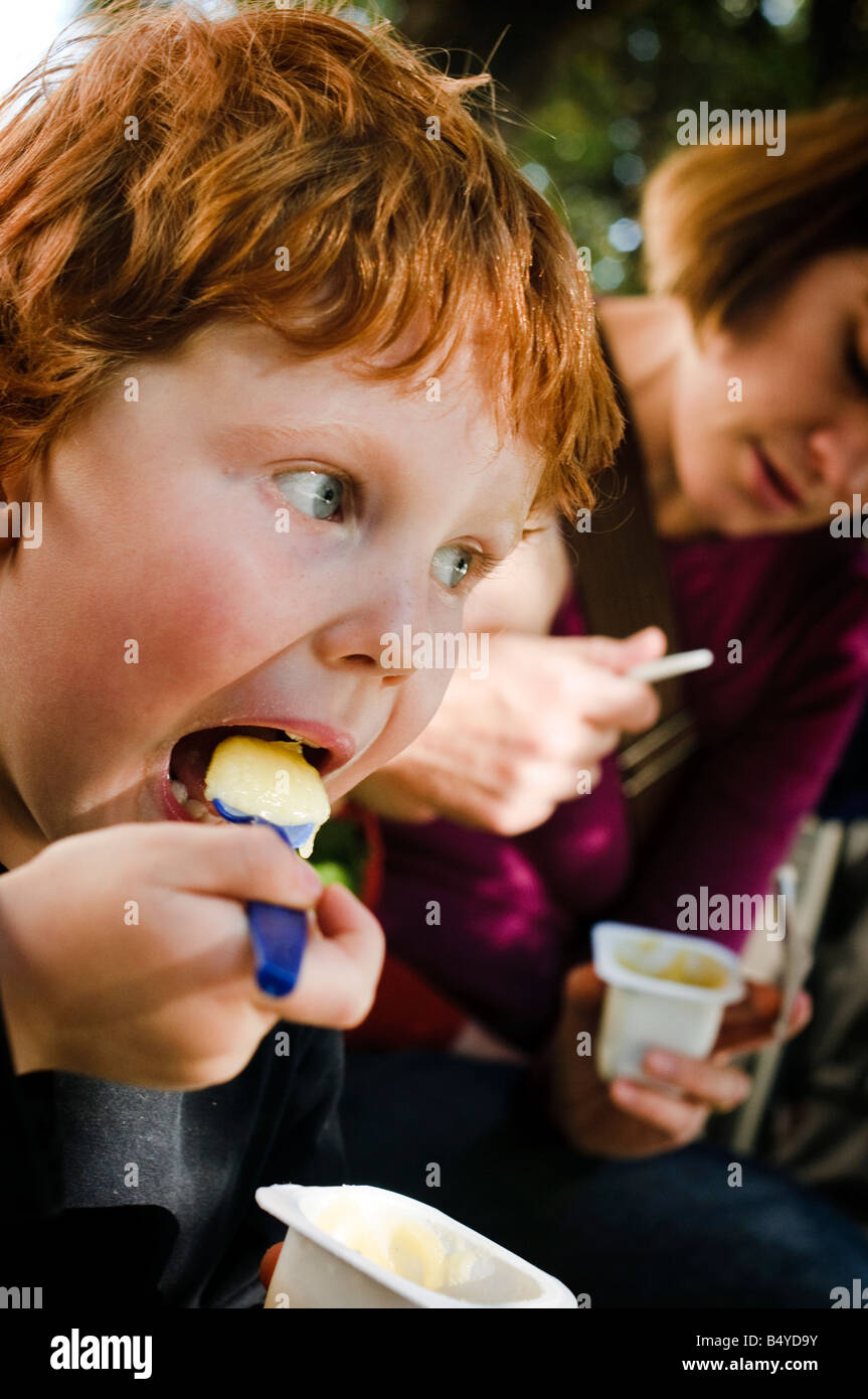 Young boy having a snack Stock Photo - Alamy