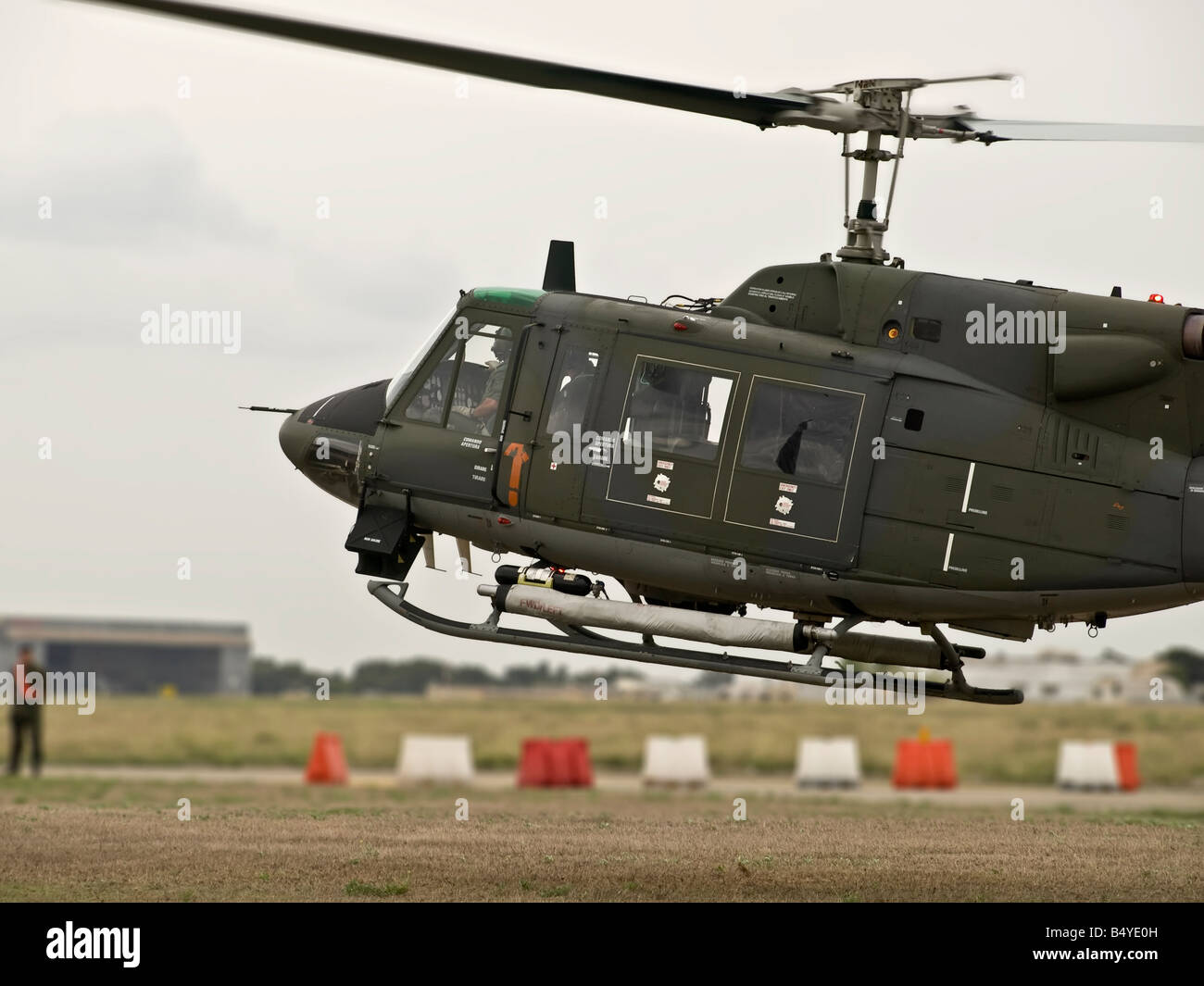 Military Huey UH1 N helicopter take off Stock Photo - Alamy