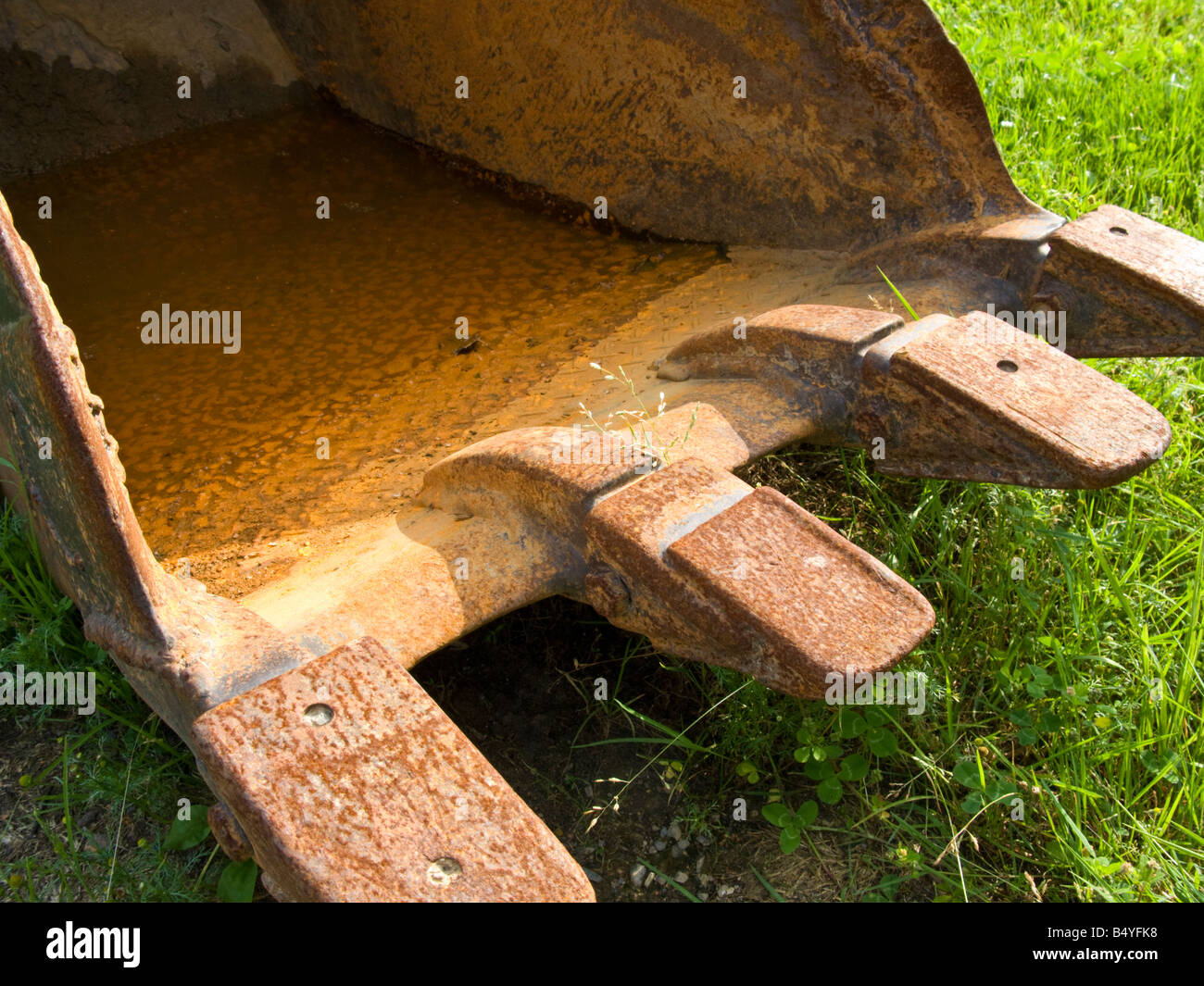 bucket of a front end loader on the ground Stock Photo - Alamy