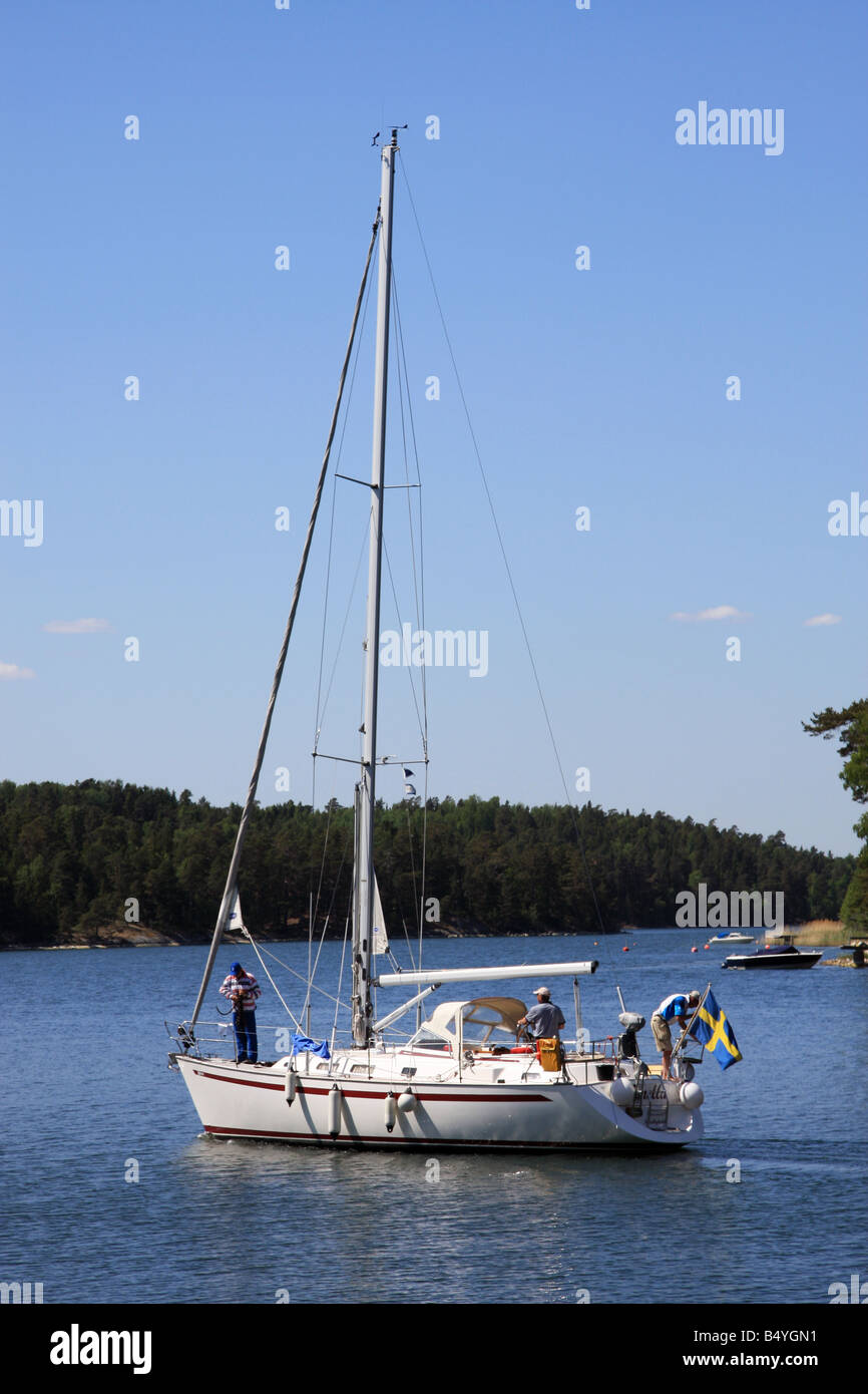 Yacht Leaving bay Stock Photo - Alamy