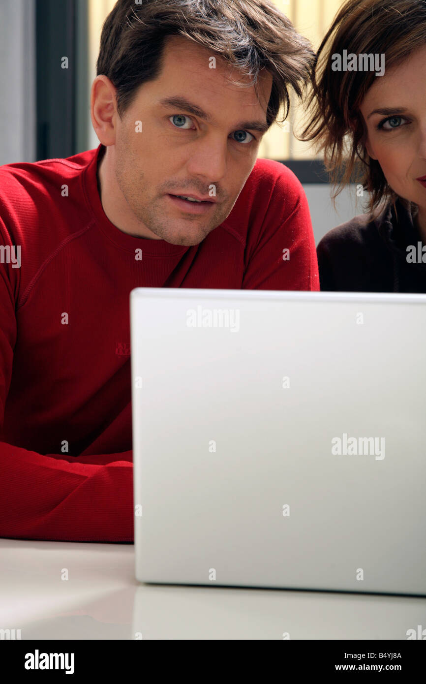 couple with notebook Stock Photo - Alamy