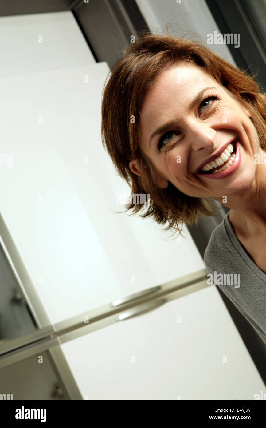 smiling woman, fridge Stock Photo - Alamy