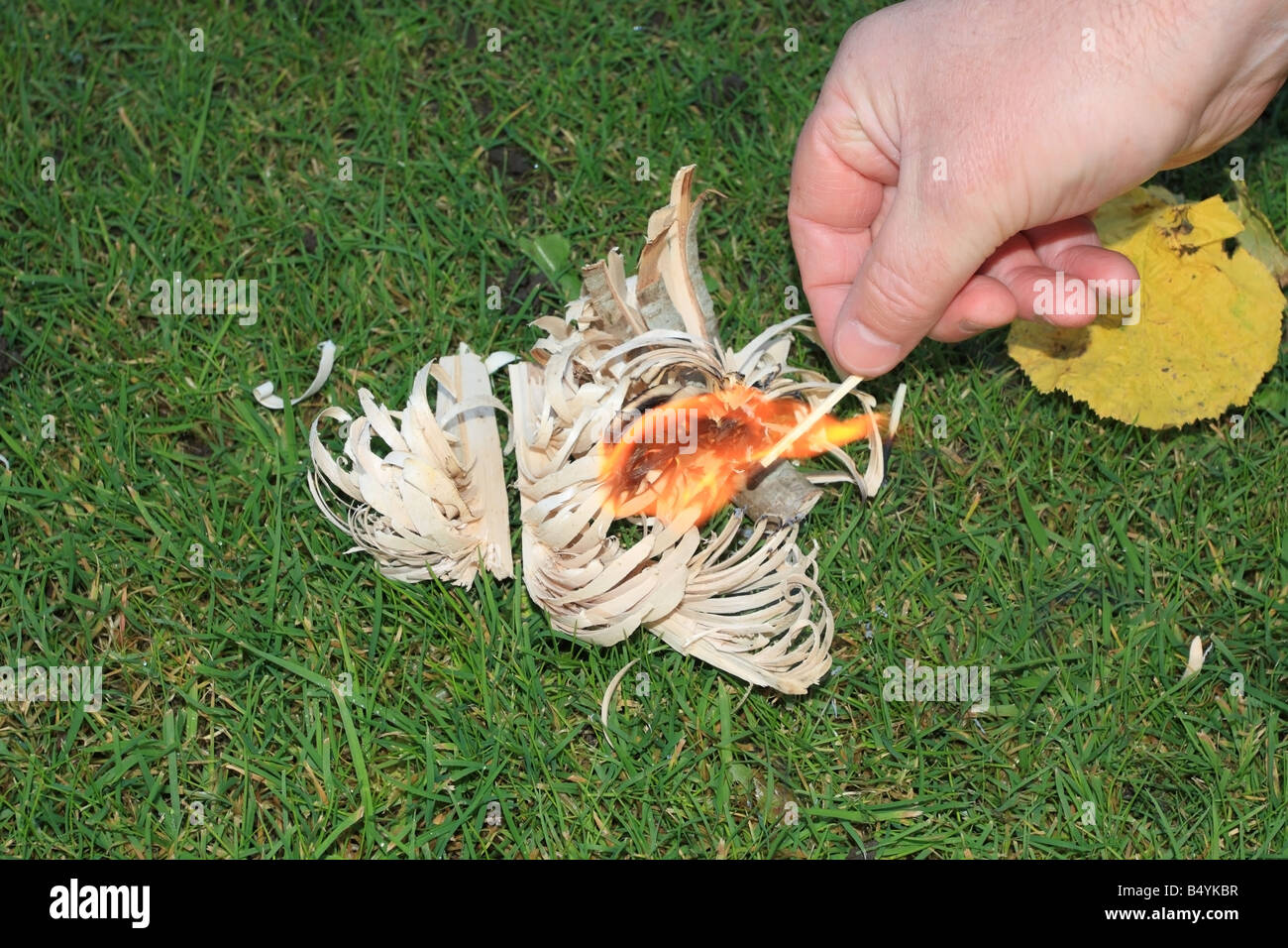 Lighting Feather Sticks to Create a Fire Stock Photo - Alamy
