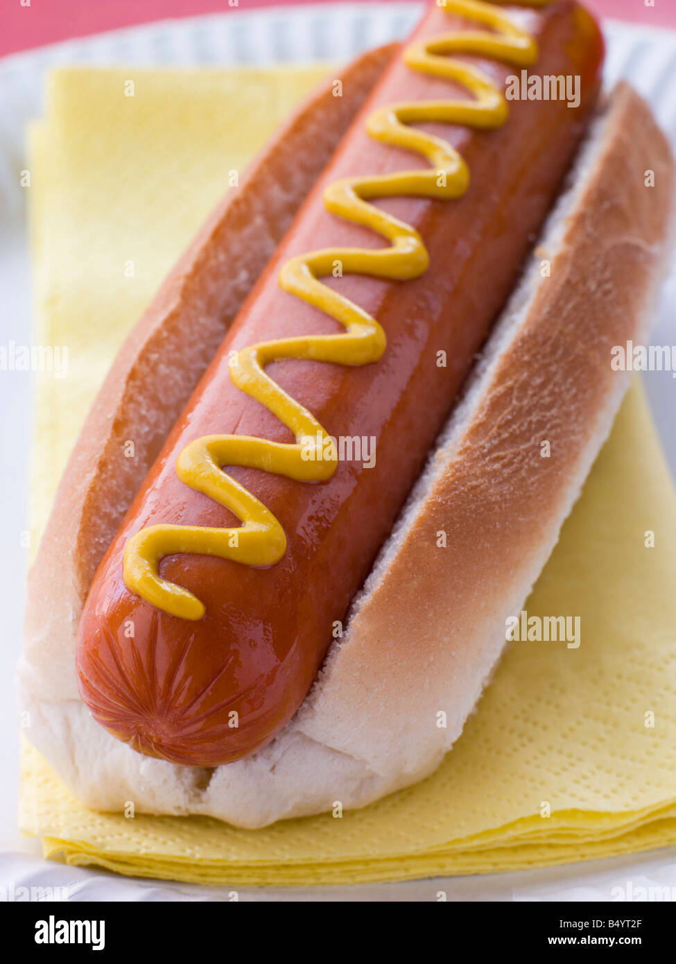 Hot Dog With Mustard Stock Photo - Alamy