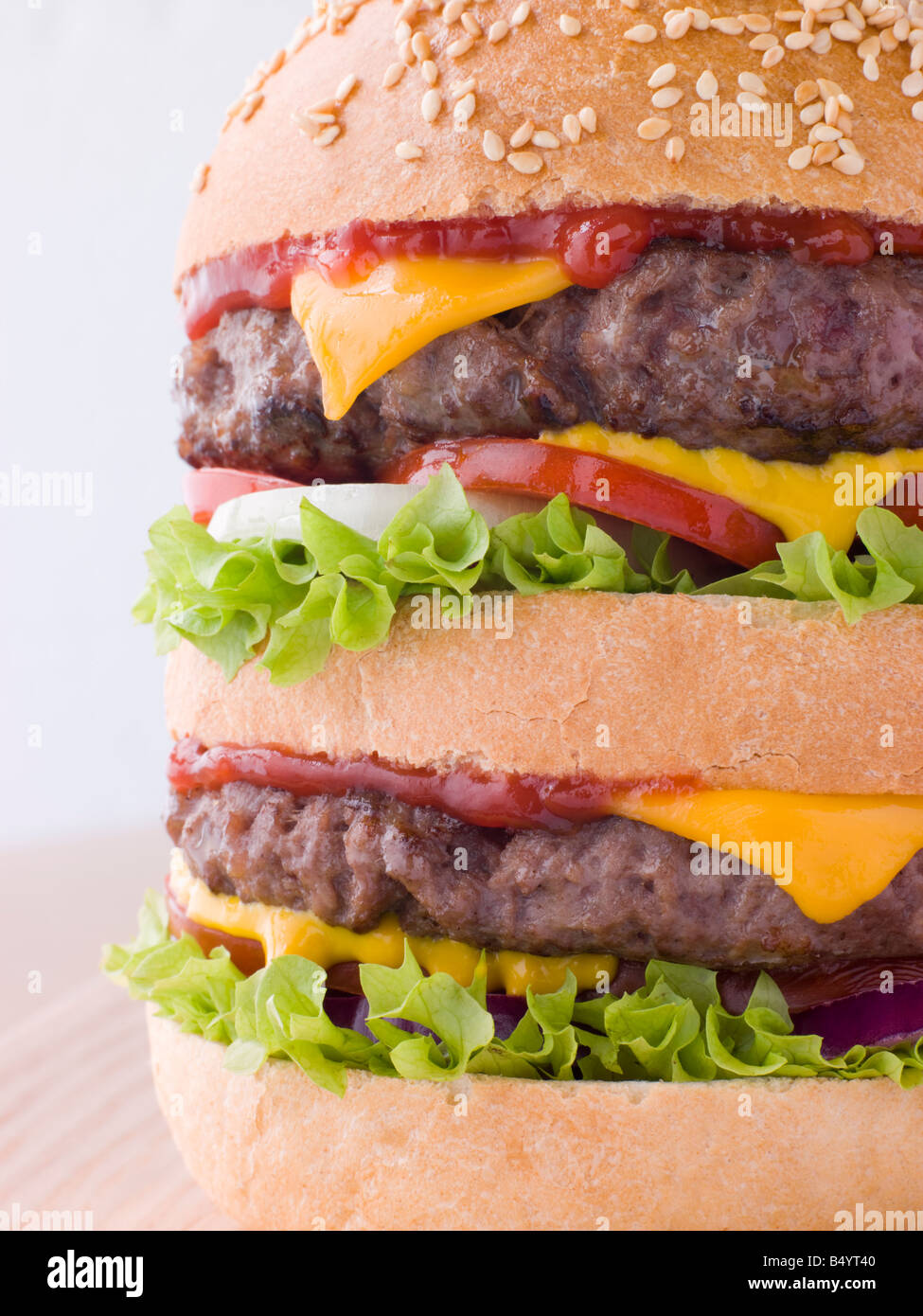 Double Cheese Burger In A Sesame Seed Bun Stock Photo - Alamy