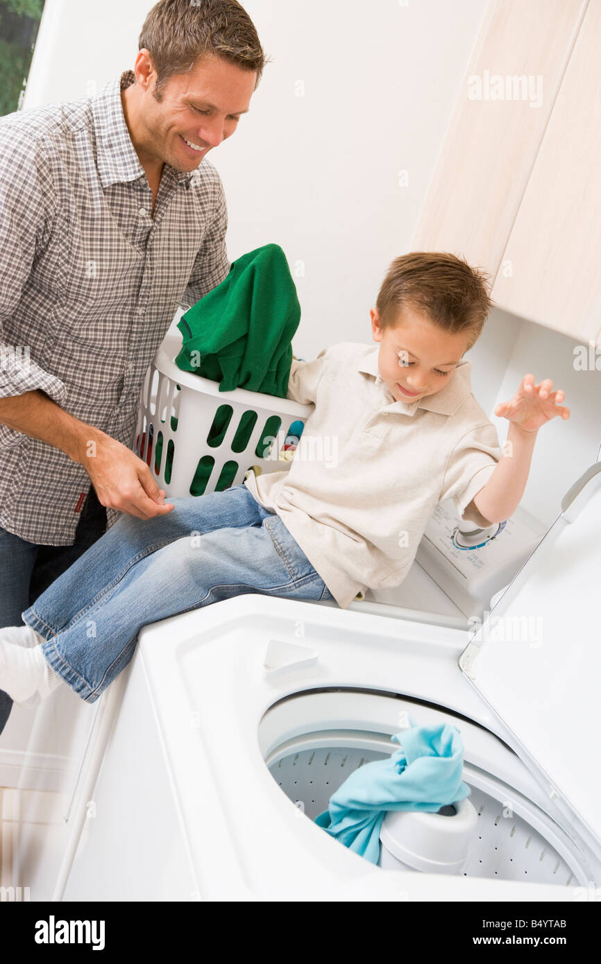 Father And Son Doing Laundry Stock Photo - Alamy